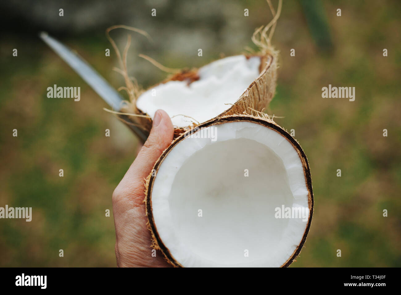 Man cutting coconut hi-res stock photography and images - Alamy
