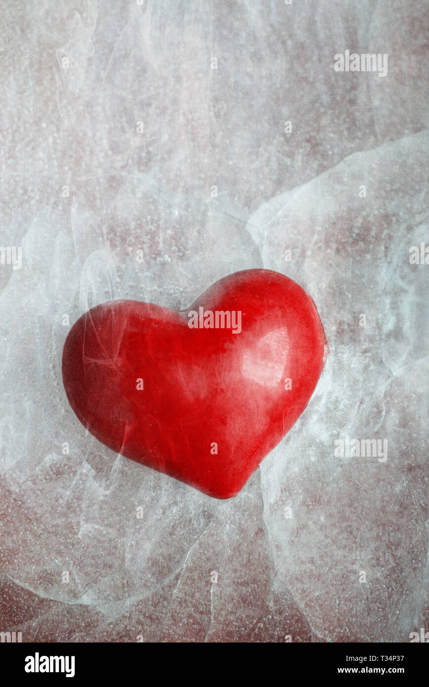 Red heart frozen in ice Stock Photo - Alamy