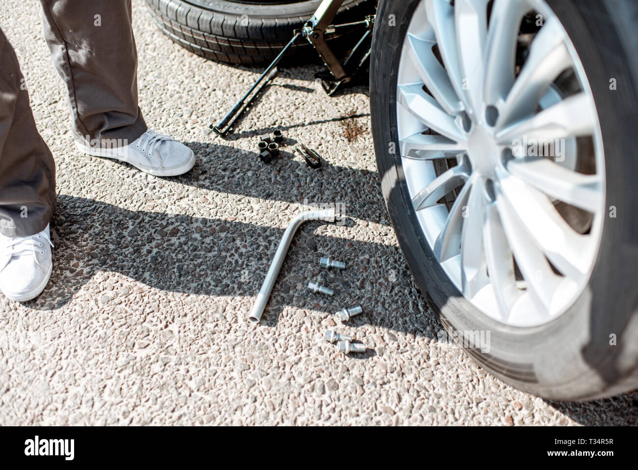 Changing wheel on the roadside, close-up view Stock Photo - Alamy