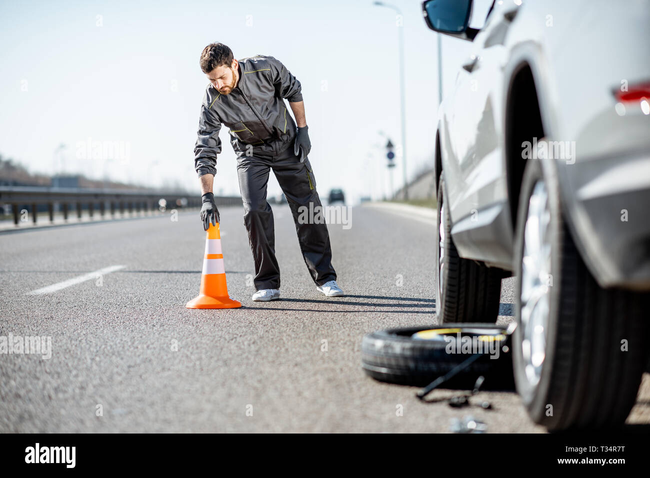 Traffic cone on broken hi-res stock photography and images - Alamy