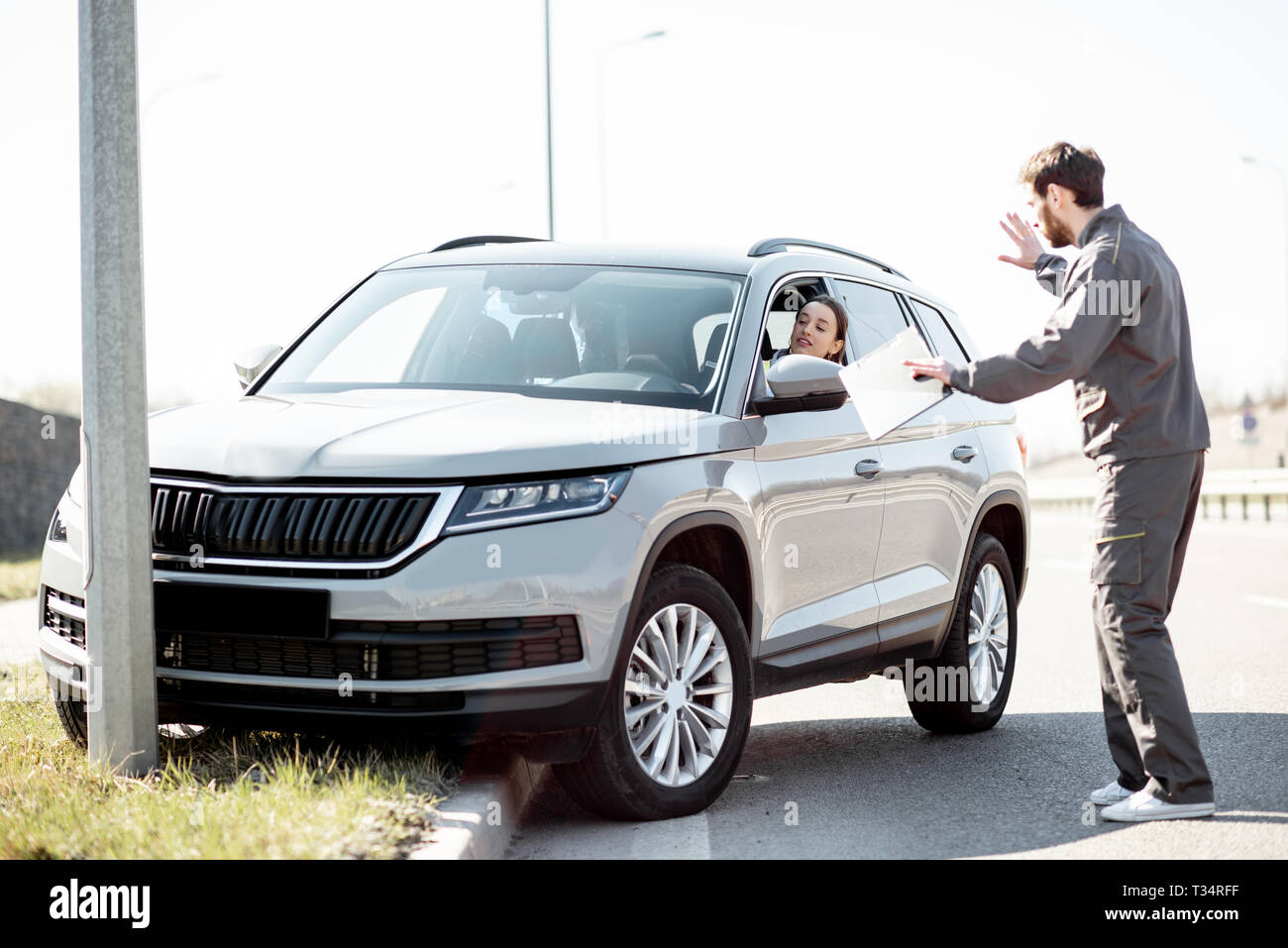 Man helping woman out of car hi-res stock photography and images - Alamy