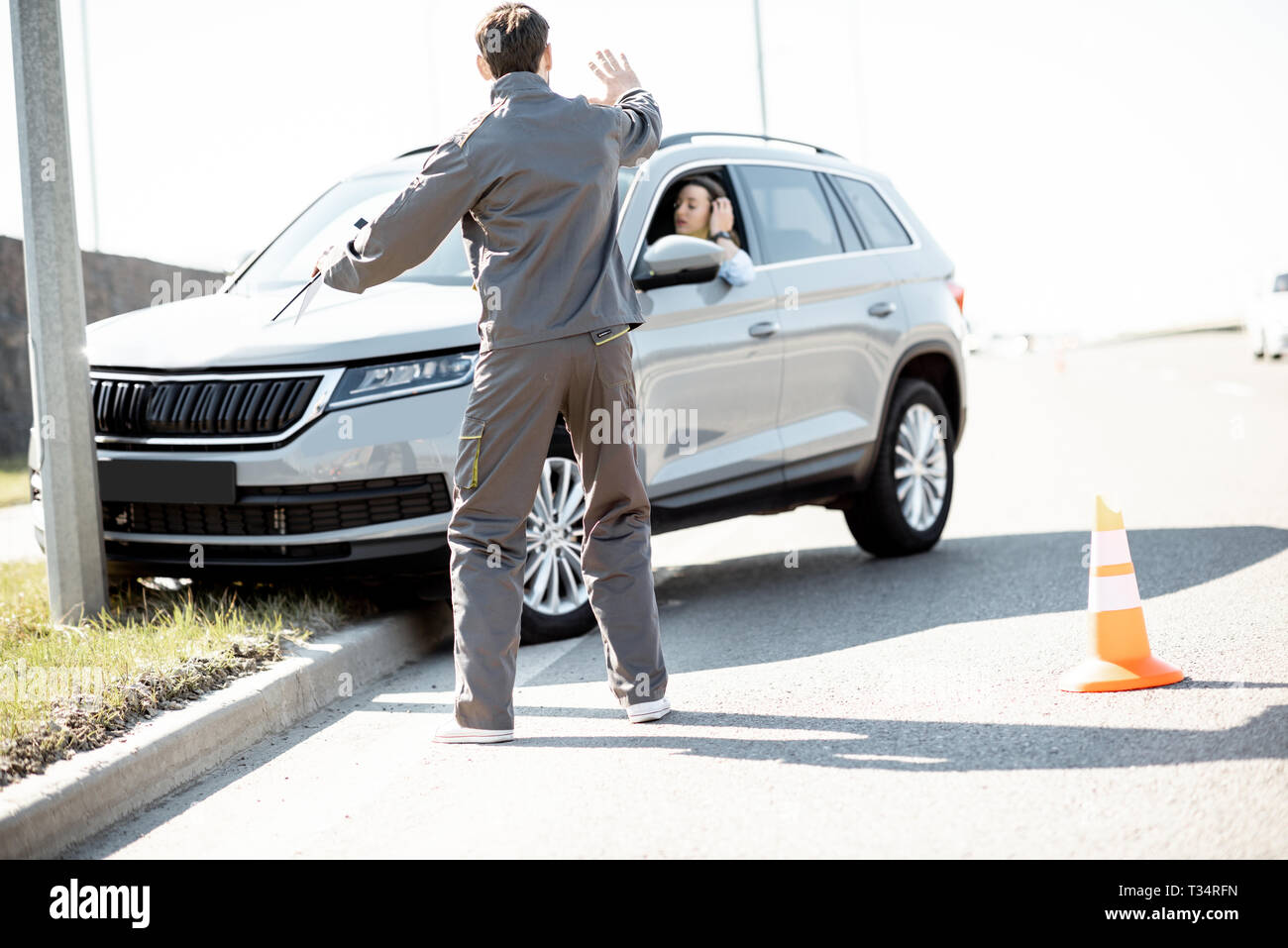 Man helping woman out of car hi-res stock photography and images - Alamy