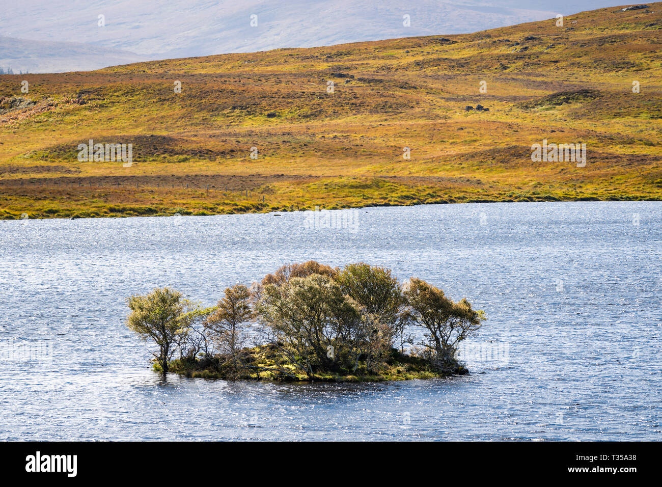 A loch with a small island in the middle near Syre, Scotland, UK Stock ...