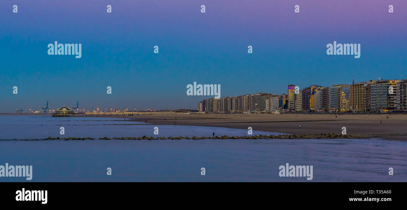 Blankenberge beach with view on the city and jetty, lighted ...