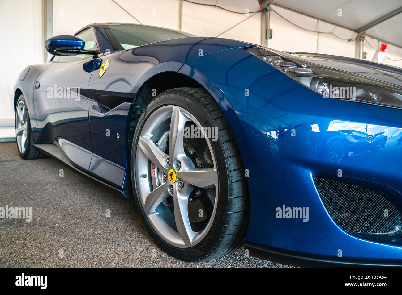 Front view of a 2019 blue Ferrari 812 superfast s-a on a country estate ...