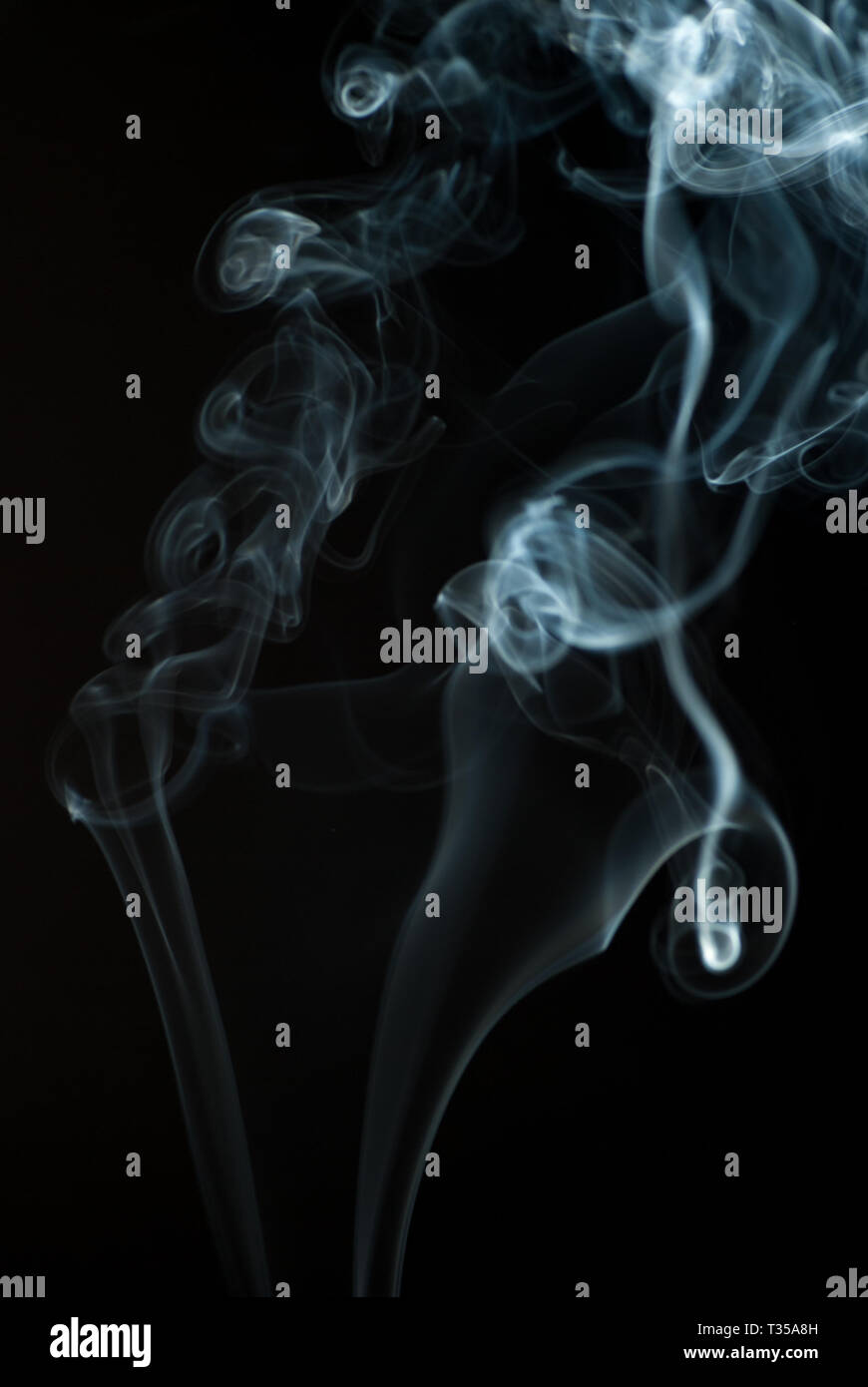 Beautiful smoke on the black background - macro photo Stock Photo - Alamy