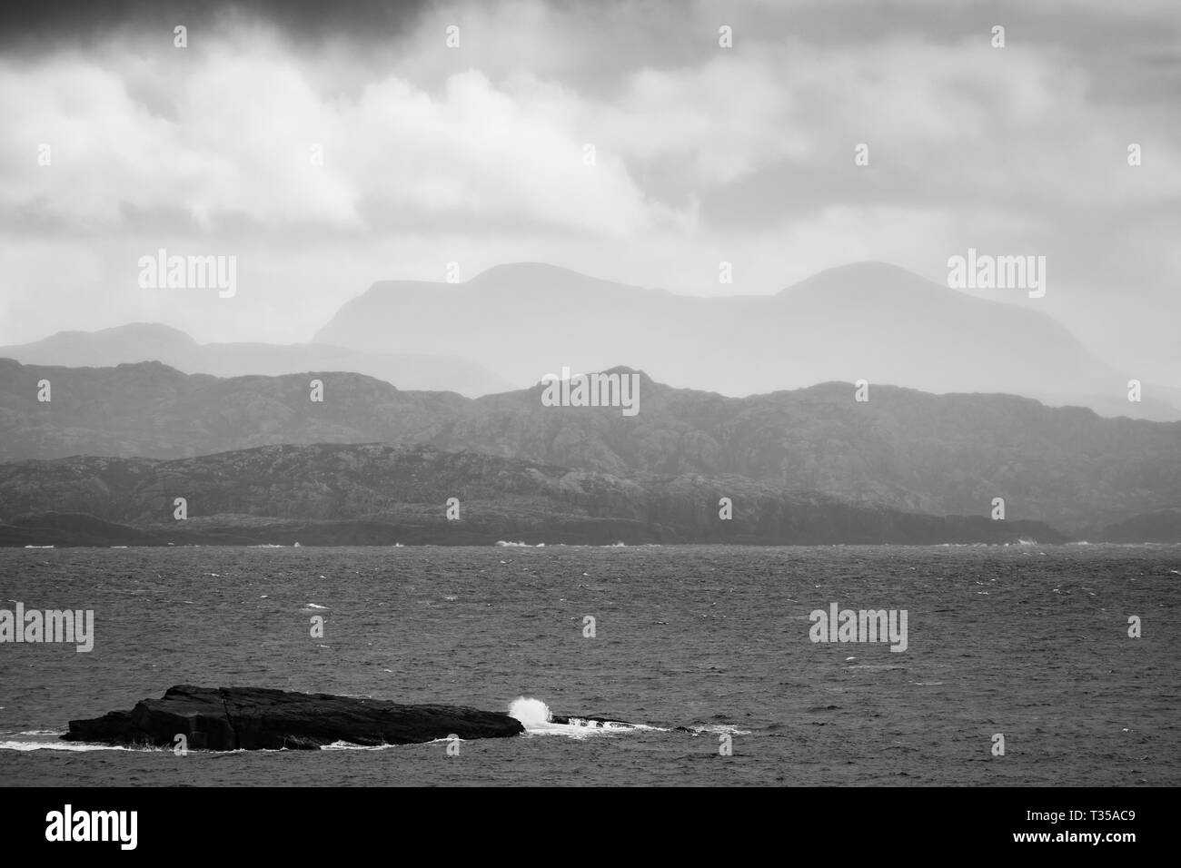 Sheathed in mist and fog, the mountain Foinaven is seen here as viewed ...