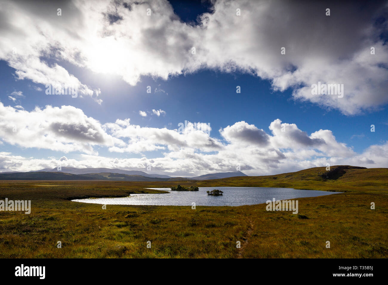 A loch with a small island in the middle near Syre, Scotland, UK Stock ...