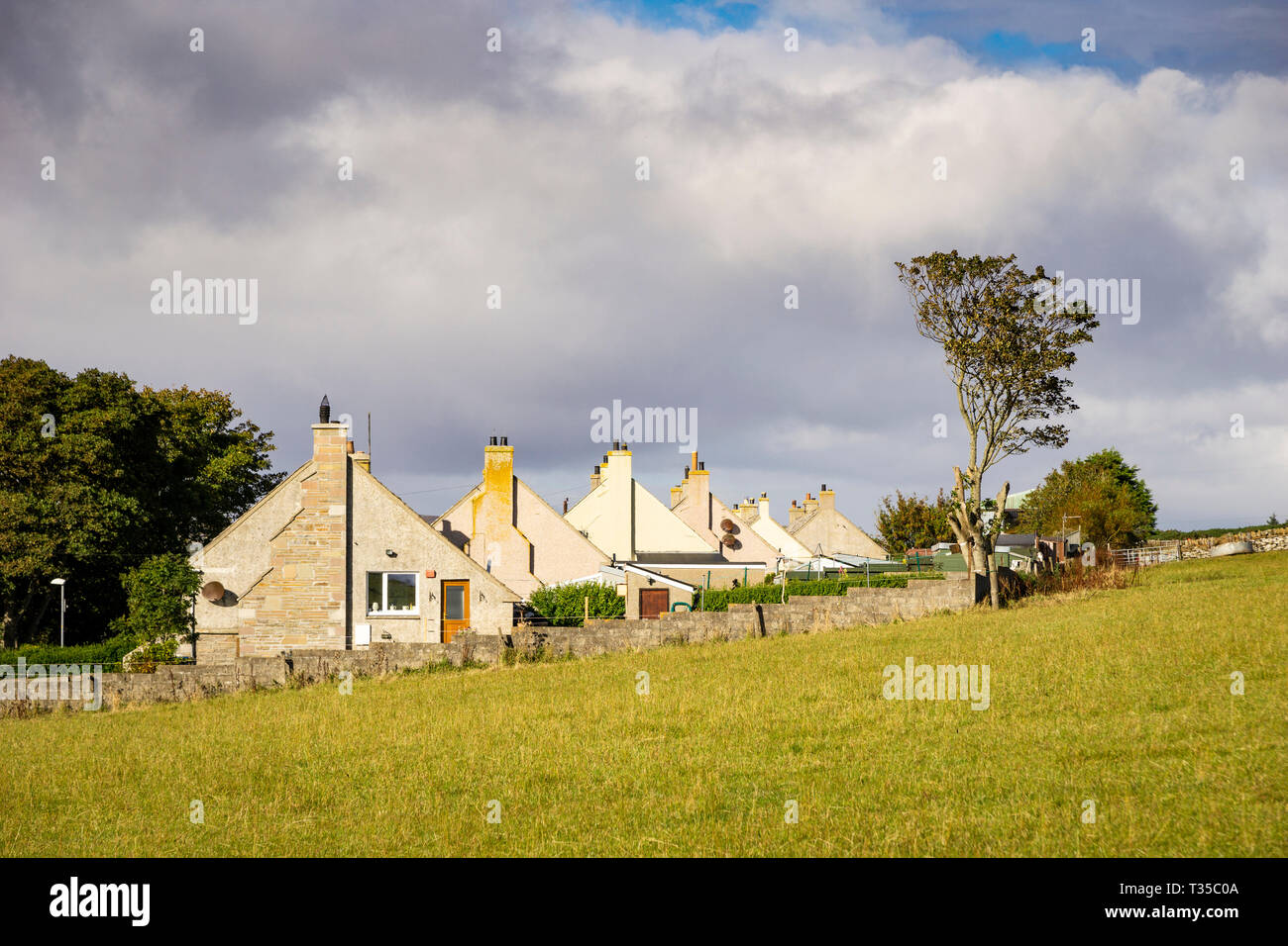 A row of houses on the side of the A9 on the east coast of northern ...