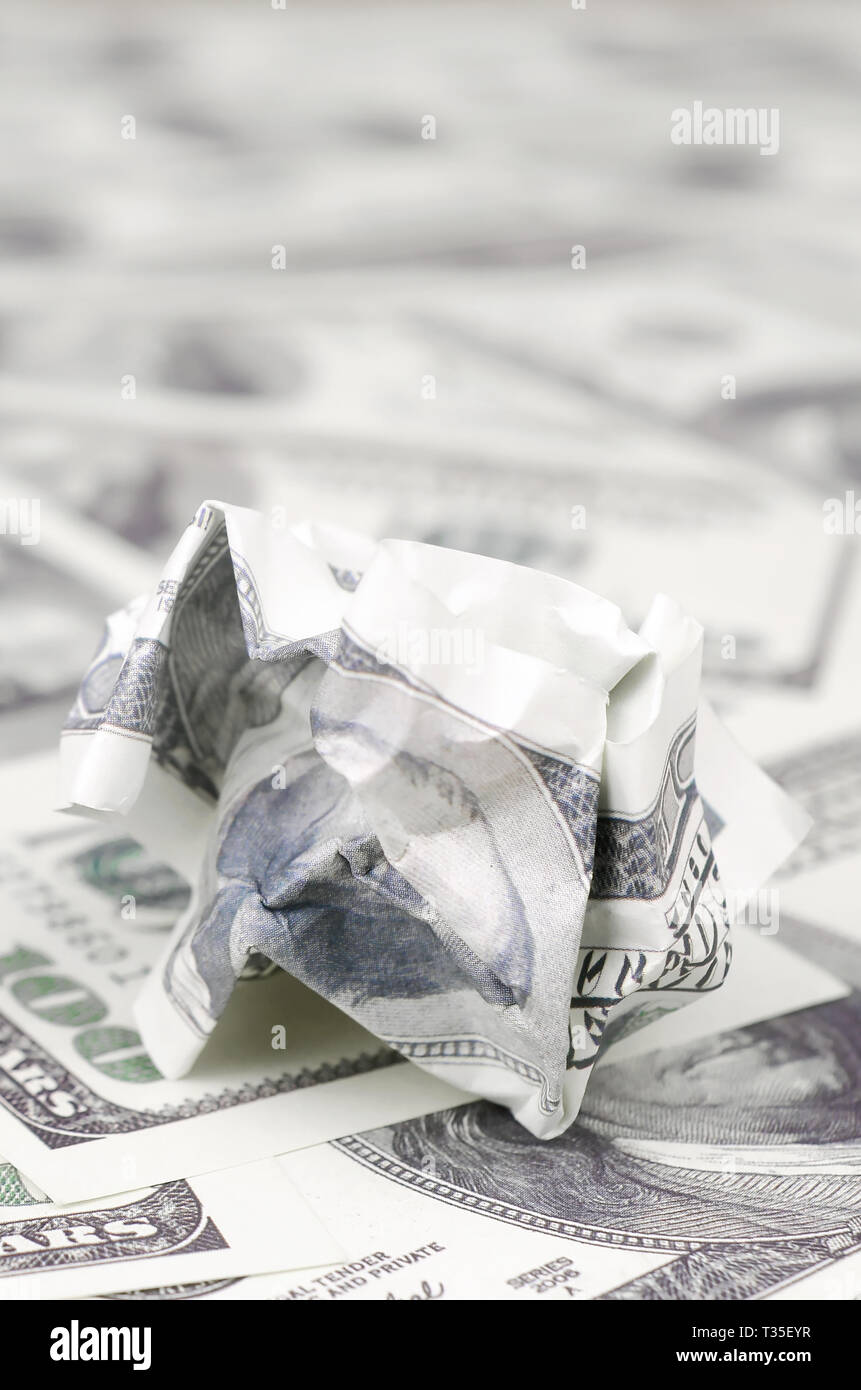 Crumpled dollar bill of the United States lies on the set of smooth ...