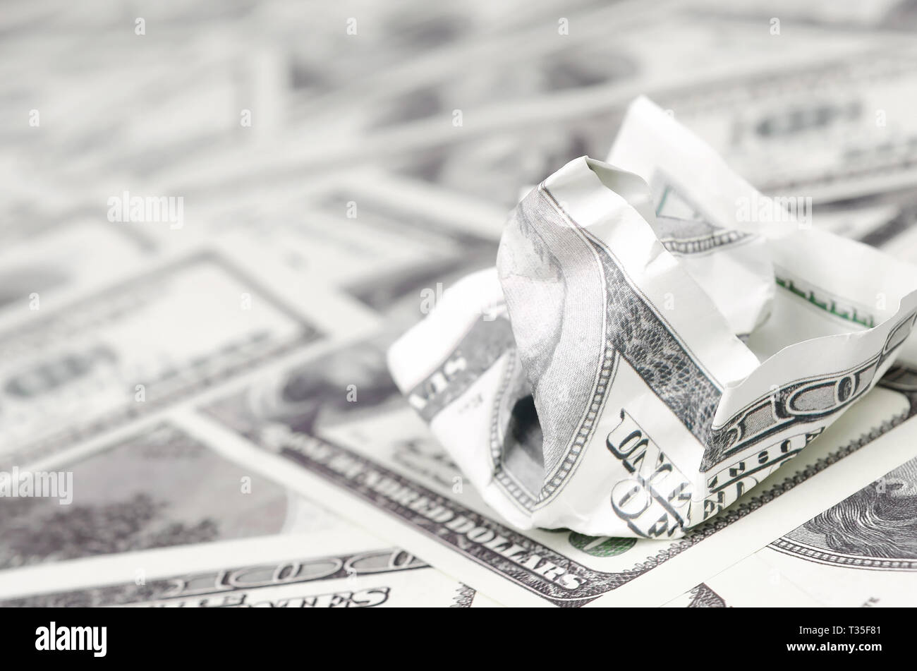 Crumpled dollar bill of the United States lies on the set of smooth ...