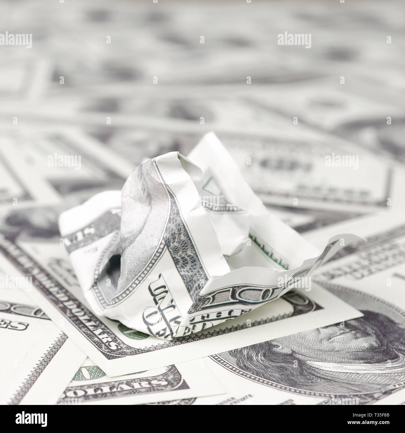 Crumpled dollar bill of the United States lies on the set of smooth ...