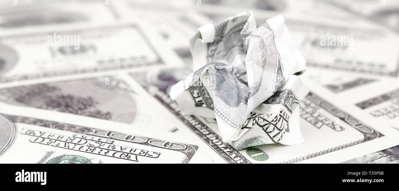 Crumpled dollar bill of the United States lies on the set of smooth ...