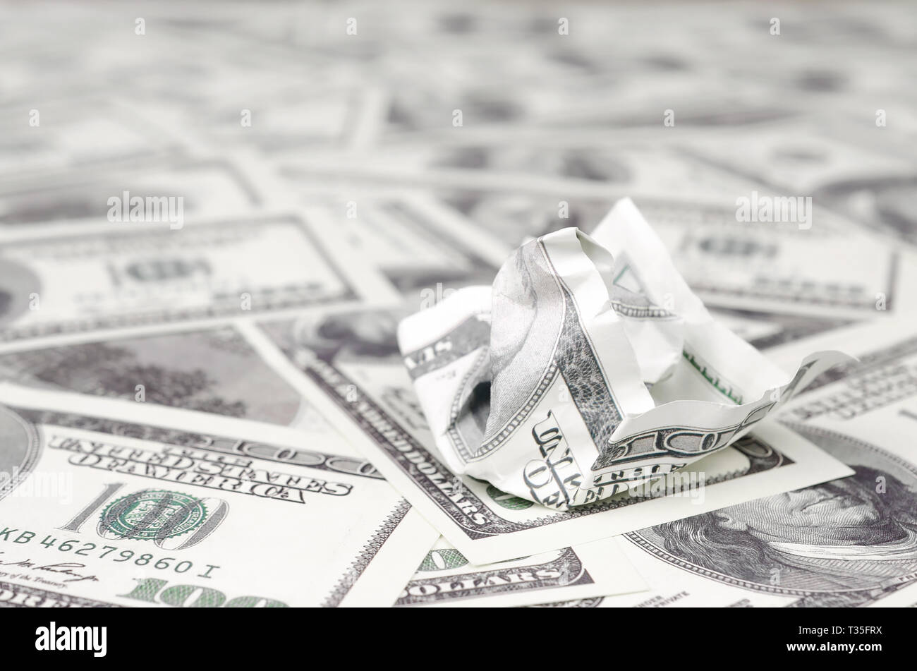 Crumpled dollar bill of the United States lies on the set of smooth ...