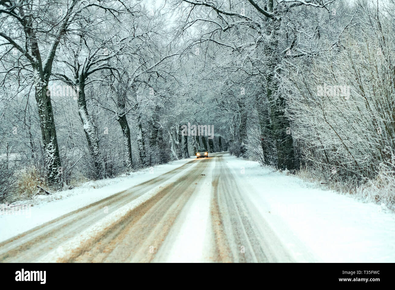 car track covered with snow, snow on the highway Stock Photo - Alamy
