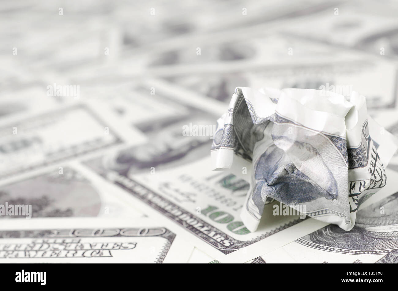 Crumpled dollar bill of the United States lies on the set of smooth ...