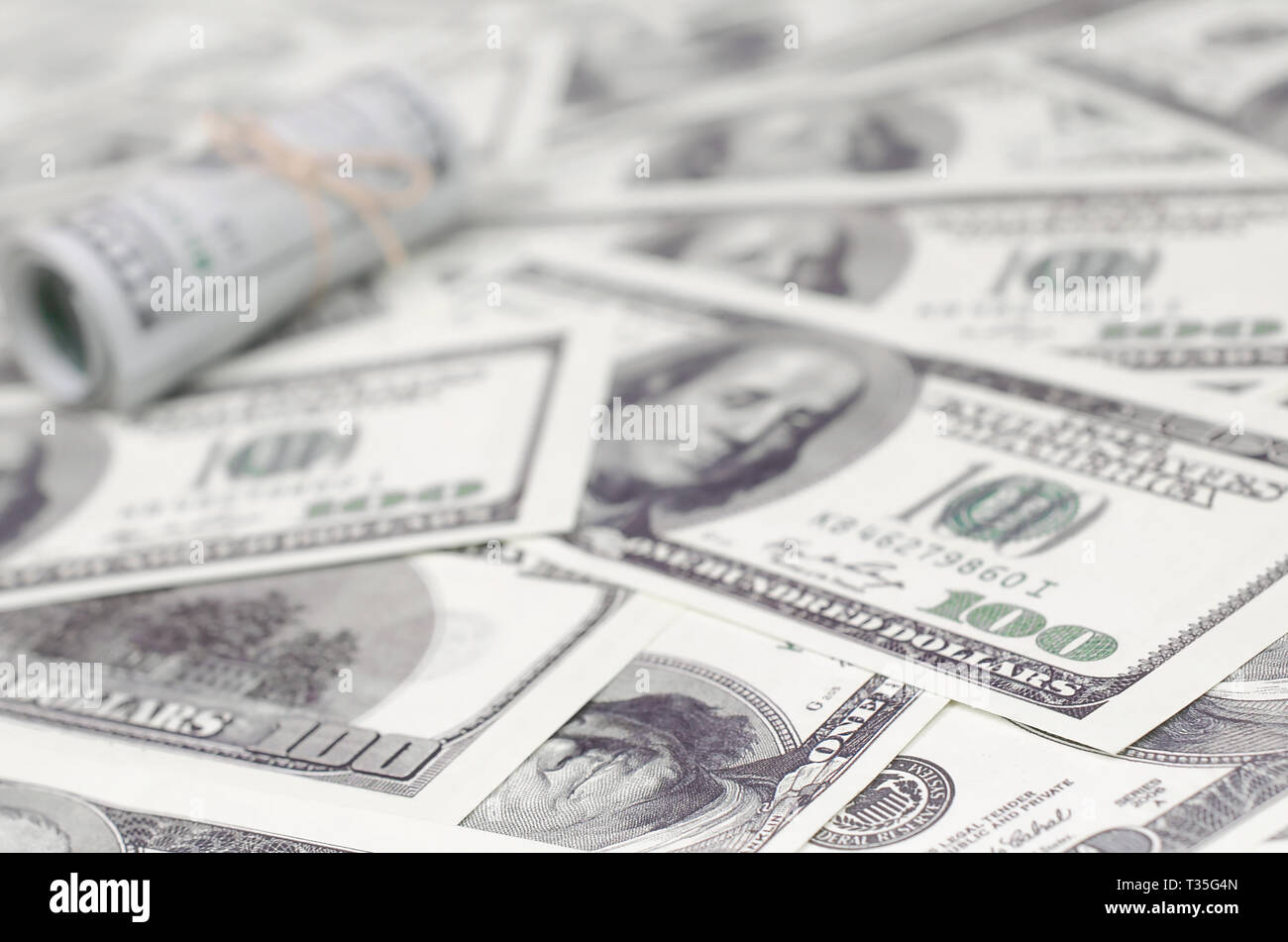 US dollars rolled up and tightened with band lies on a lot of american ...