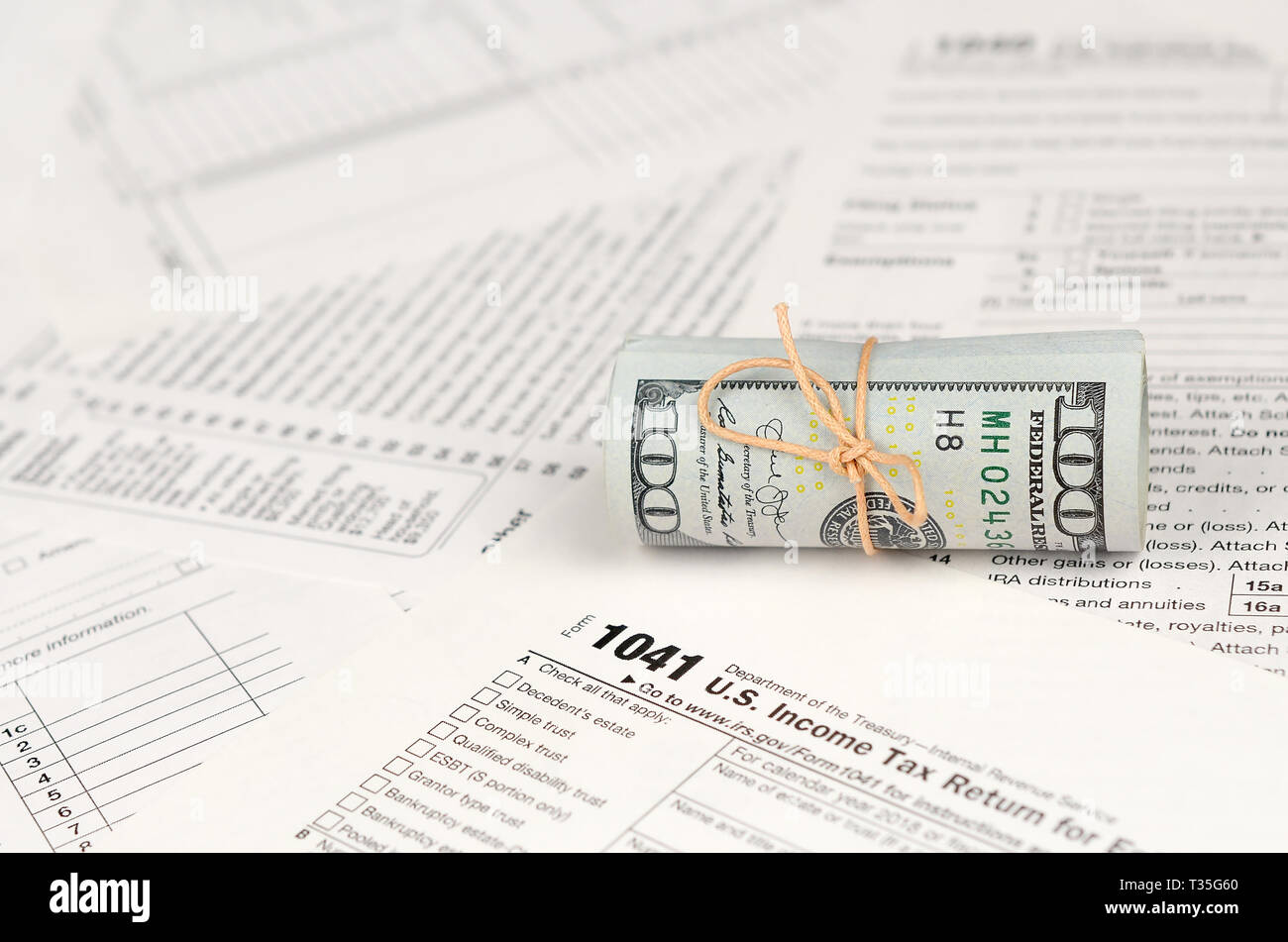 1041 U.S. Income tax return for Estates and Trusts form with roll of ...