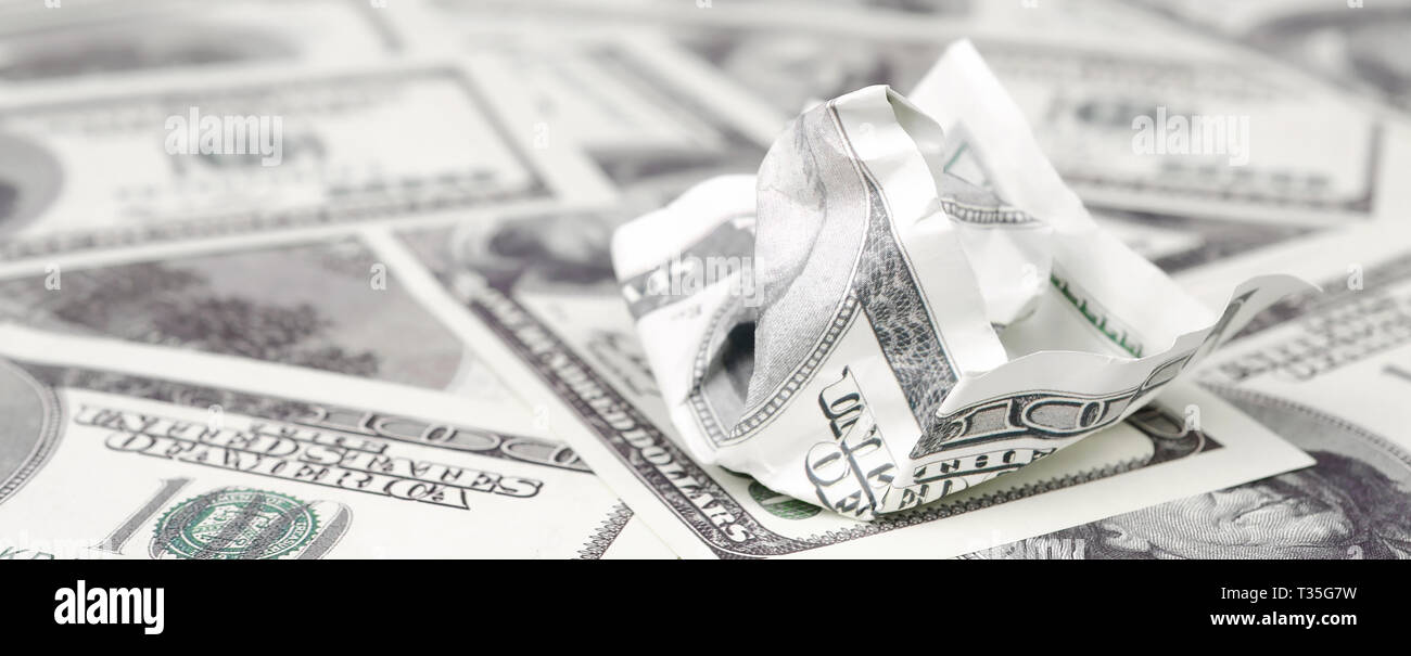 Crumpled dollar bill of the United States lies on the set of smooth ...