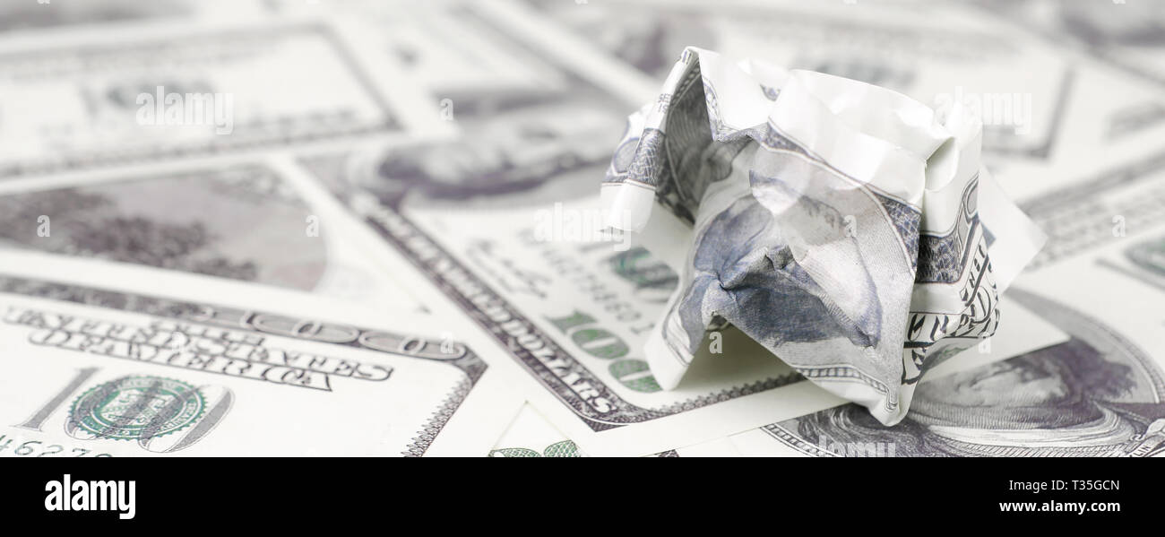 Crumpled dollar bill of the United States lies on the set of smooth ...