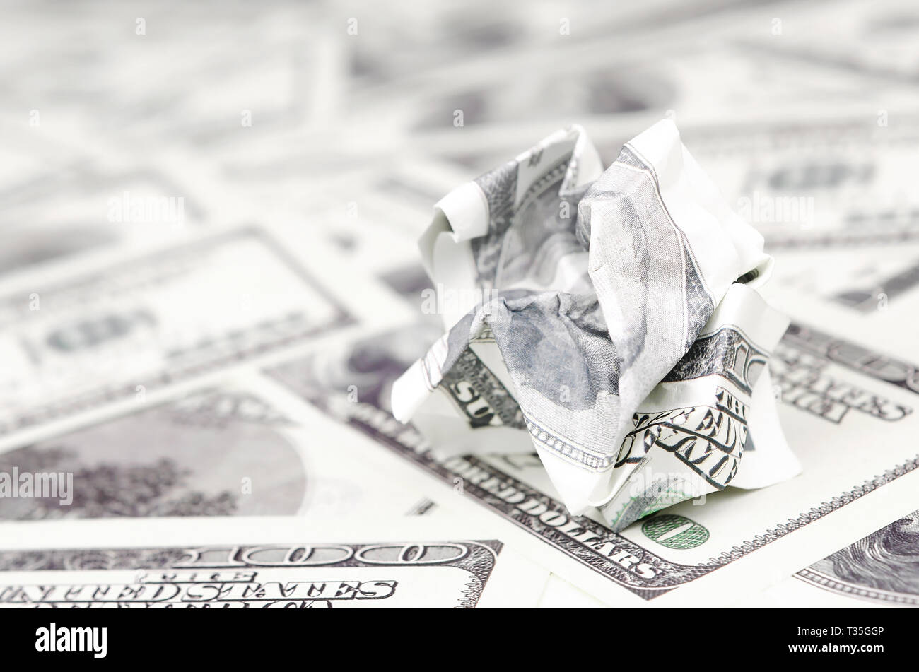 Crumpled dollar bill of the United States lies on the set of smooth ...