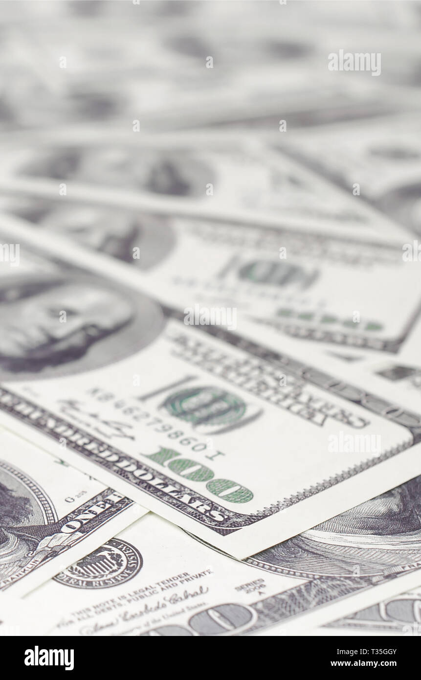 US dollars rolled up and tightened with band lies on a lot of american ...