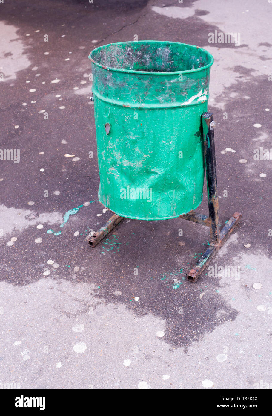 green metal garbage can on the street. citylife, objects Stock Photo ...