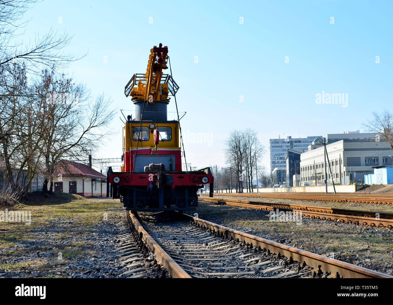 Railway crane on the platform, moving along the railway track. Special ...