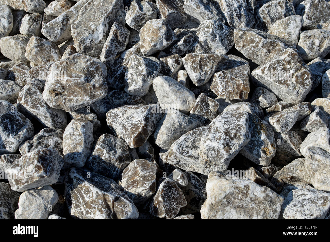 Natural gypsum stone. Close up image of stones with black and white ...
