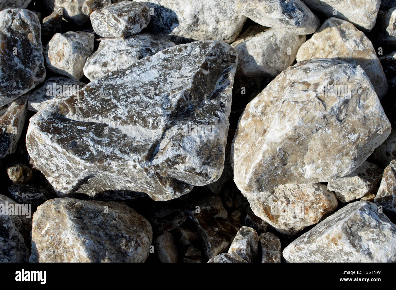 Natural gypsum stone. Close up image of stones with black and white ...