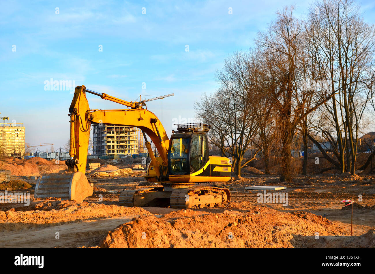 Tracked excavator loader with bucket at construction works in ...