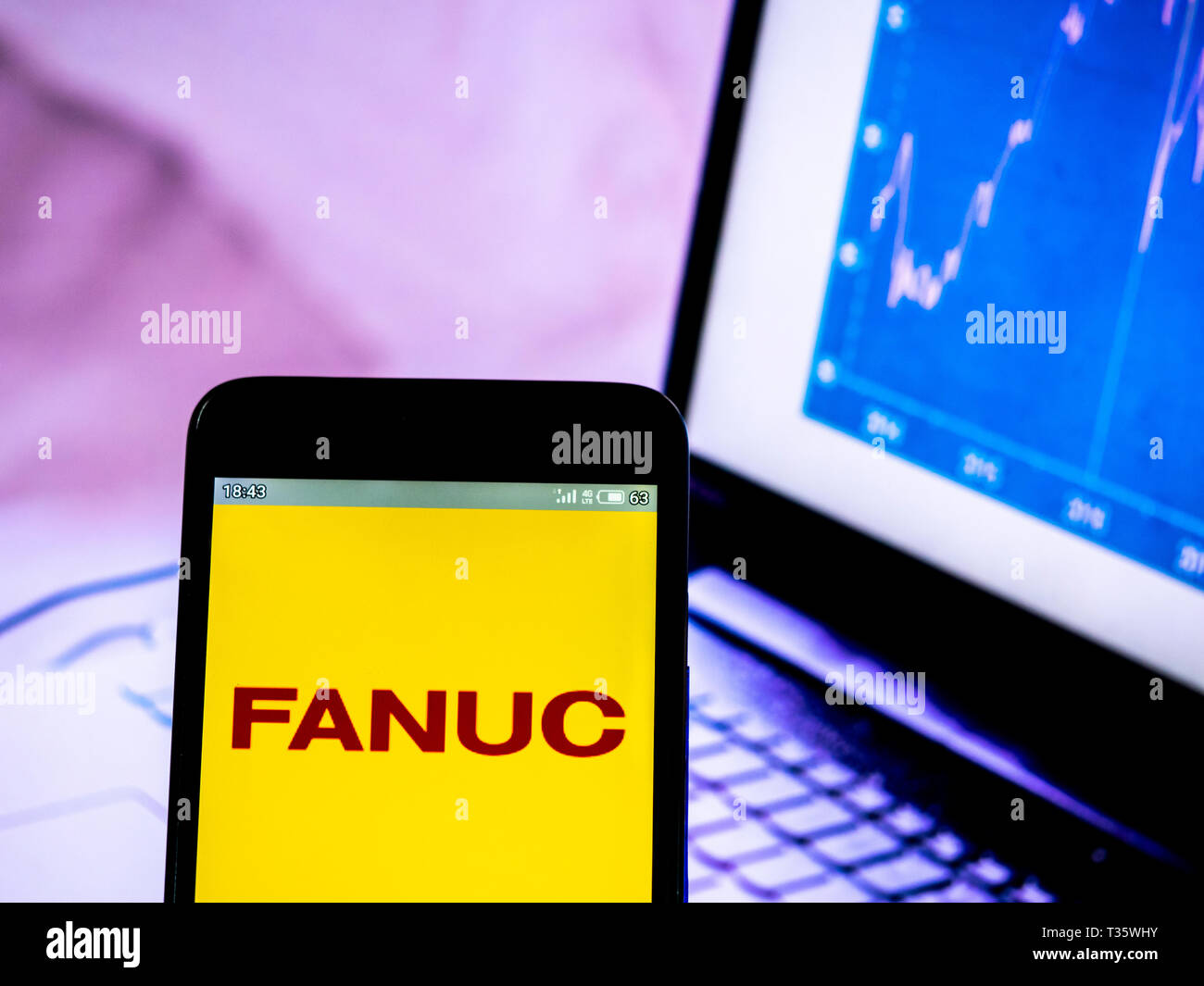 In this photo illustration a FANUC Corporation logo seen displayed on a ...