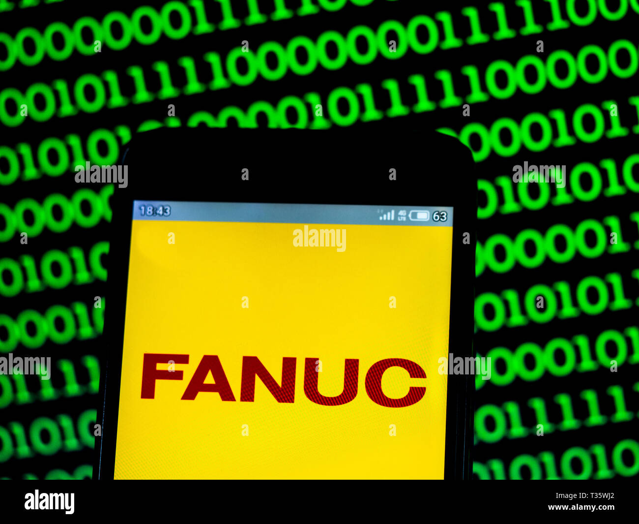 In this photo illustration a FANUC Corporation logo seen displayed on a ...