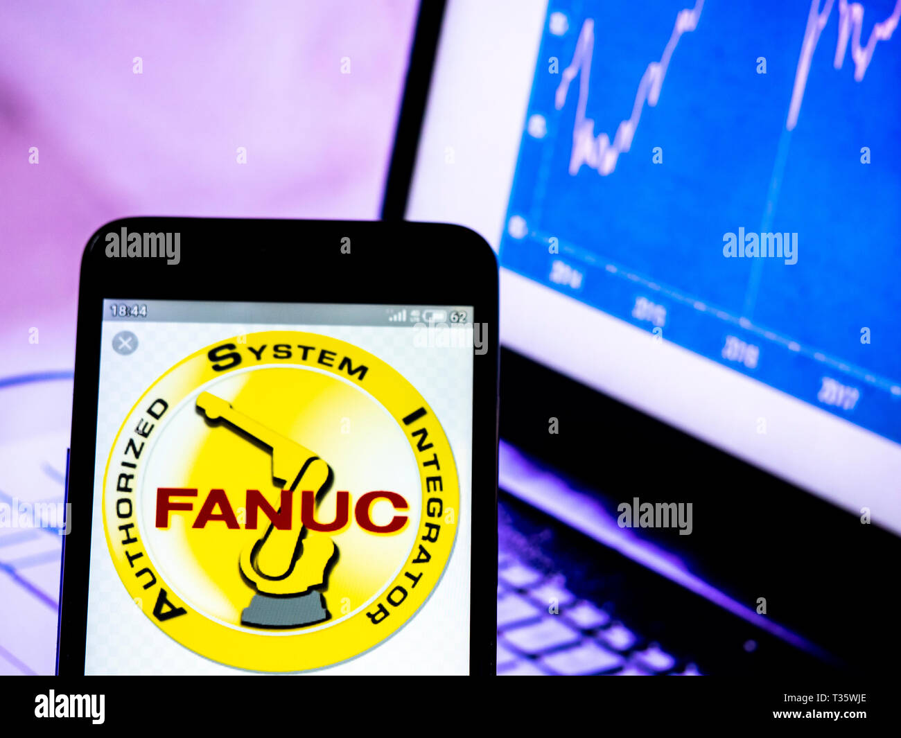 In this photo illustration a FANUC Corporation logo seen displayed on a ...