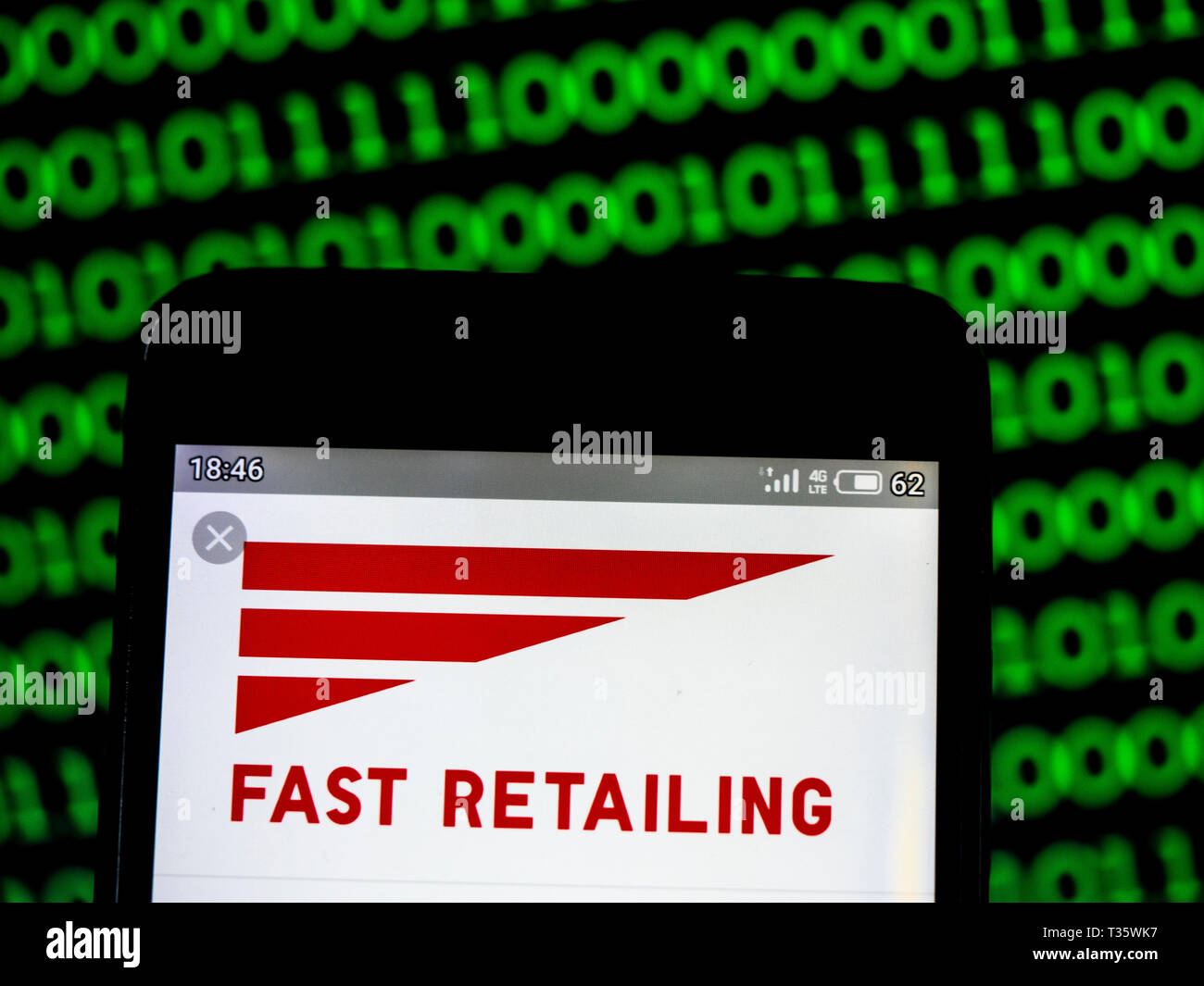 In this photo illustration a Fast Retailing Co., Ltd. logo seen ...