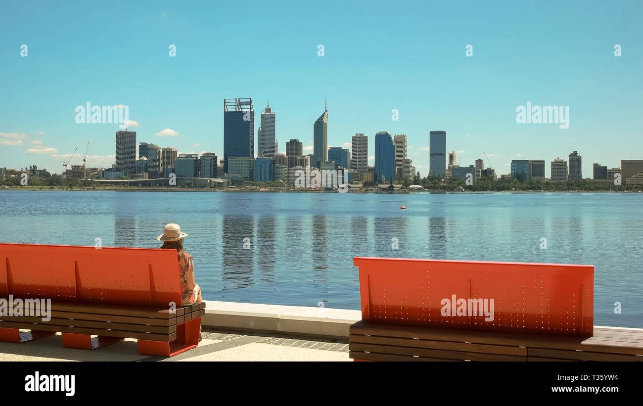 perth, swan river and tourist on park bench Stock Photo - Alamy