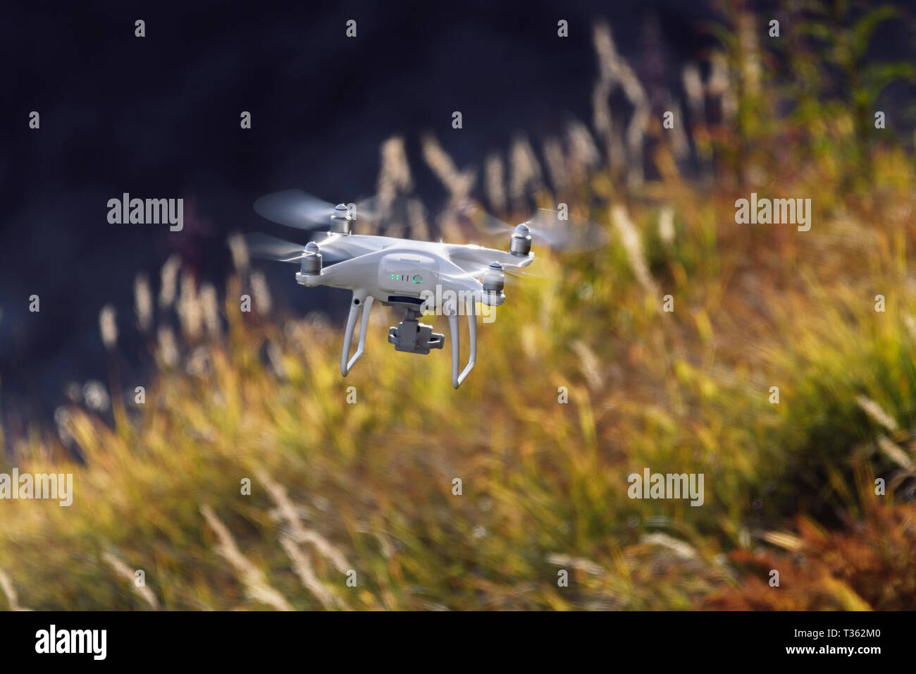Drone flying over field at sunset hi-res stock photography and images ...