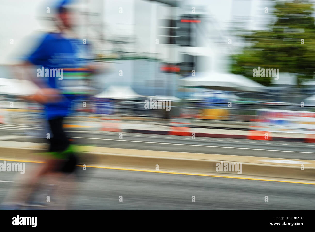 Motion blur picture of a man running by during a running event Stock ...