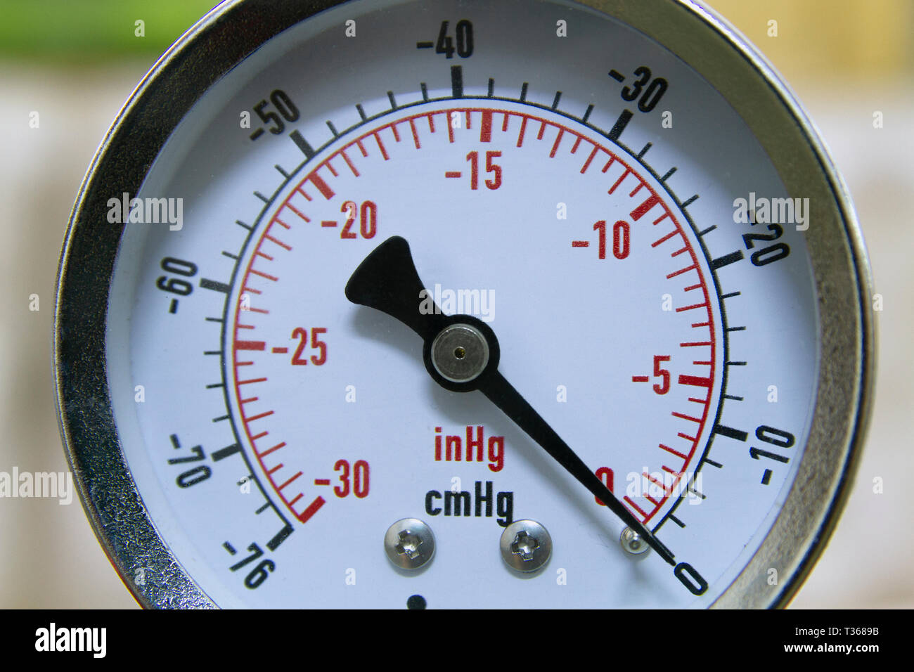 Vacuum pressure gauge meter in a close-up picture Stock Photo - Alamy