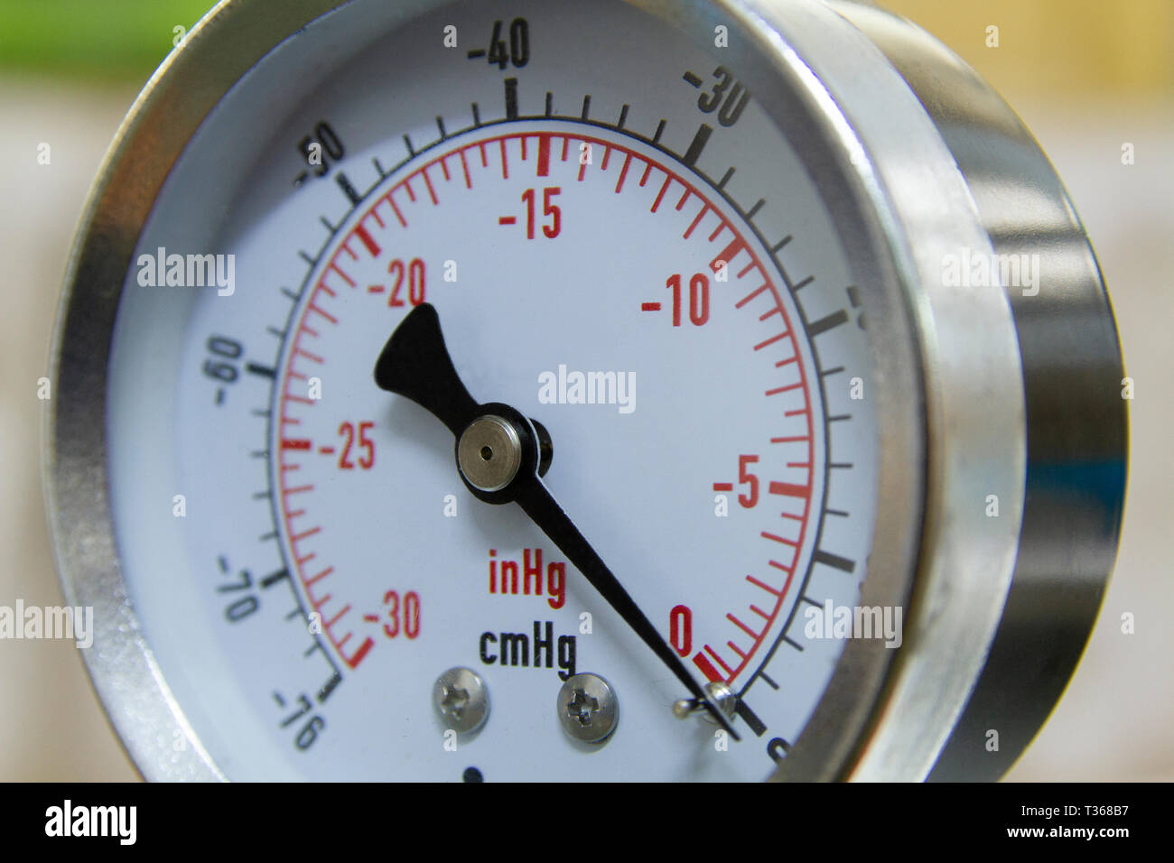 Vacuum pressure gauge meter in a close-up picture Stock Photo - Alamy