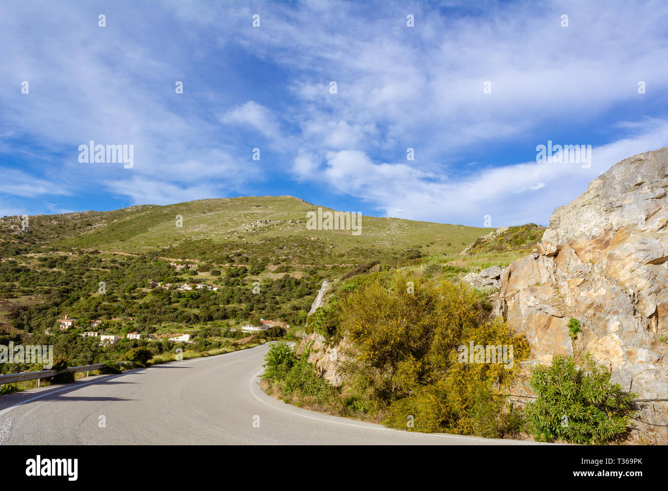 Asphalt road on west coast of Crete on a sunny spring day. Greece ...