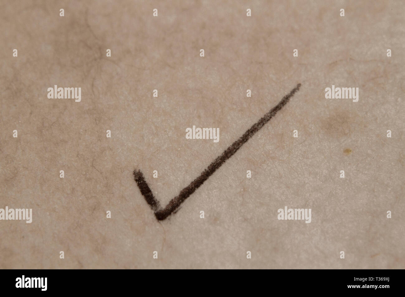 Check mark handwriting on the old paper Stock Photo - Alamy