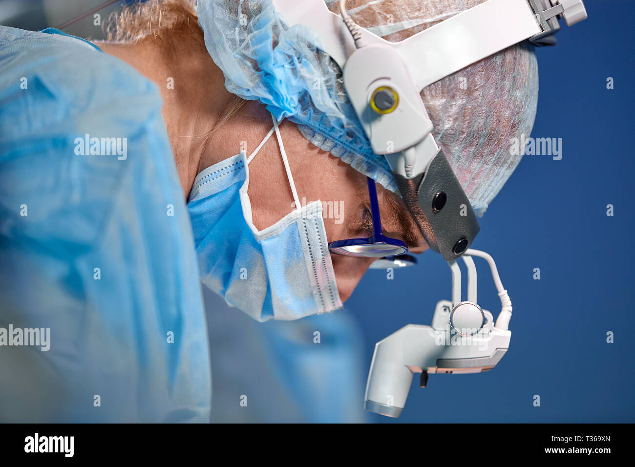 Close up portrait of female surgeon doctor wearing protective mask and ...