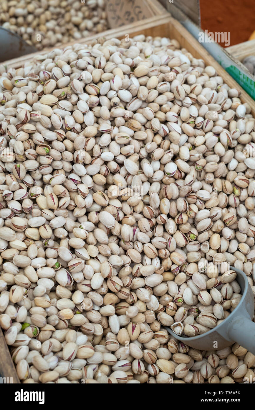 Pistachio nuts with scoop on display for sale on market stall at old ...