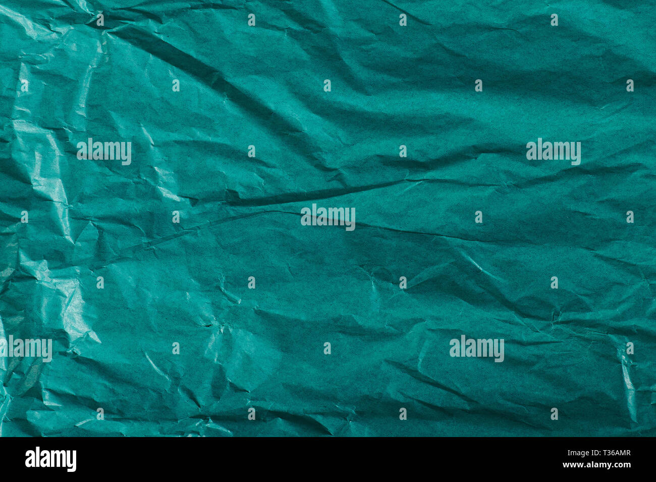 Green packing paper background close up view Stock Photo - Alamy