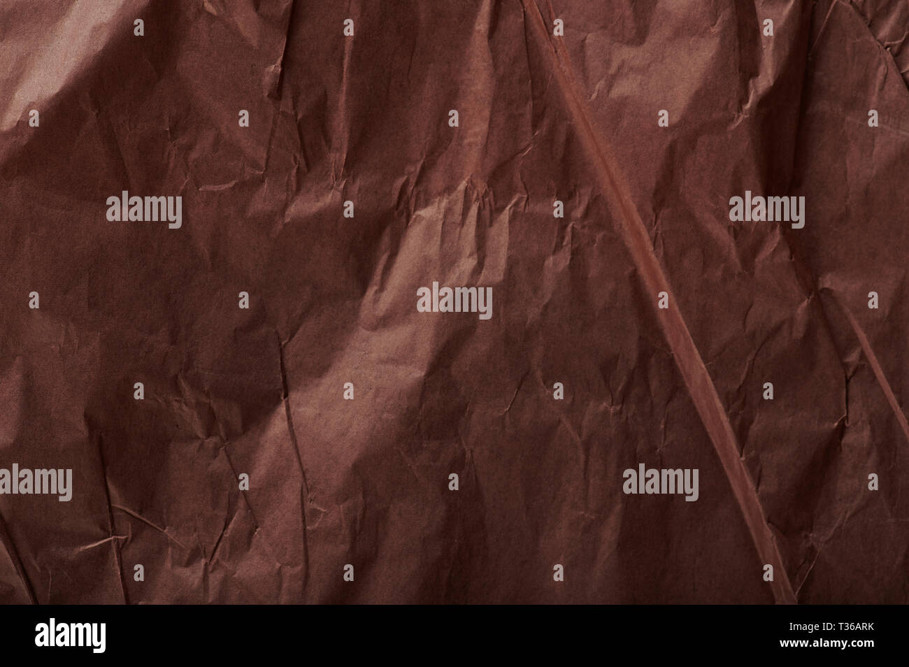 Brown wrinkled packing paper background close up view Stock Photo - Alamy