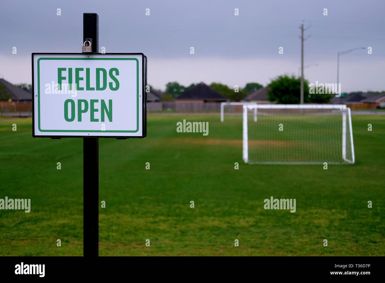 Fields Open sign at a youth soccer field on an overcast, rainy day ...