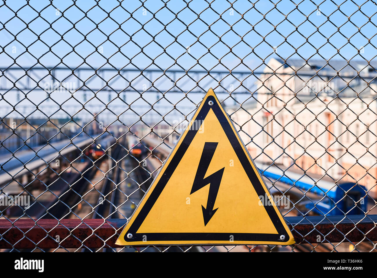 Electrical hazard sign. Lightning on yellow background close up. High ...