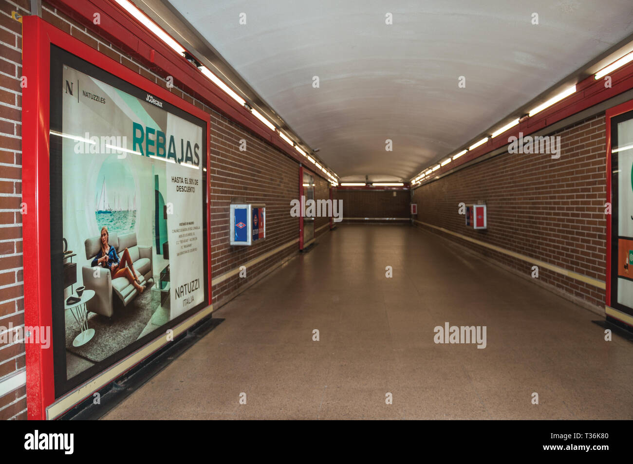 Advertising in passageway linking modern stations at the Madrid Subway ...