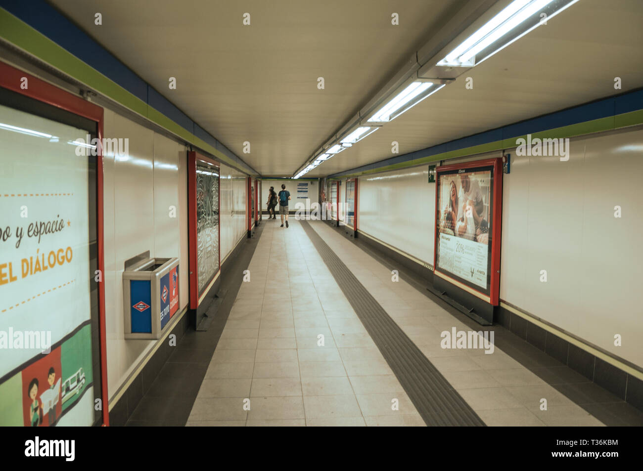Advertising and people in passageway linking modern stations at the ...